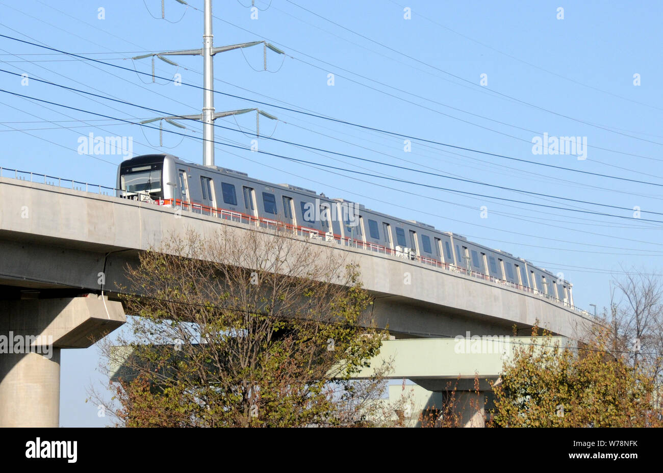 A metro train runs on the Yanfang Line, the China's first fully ...