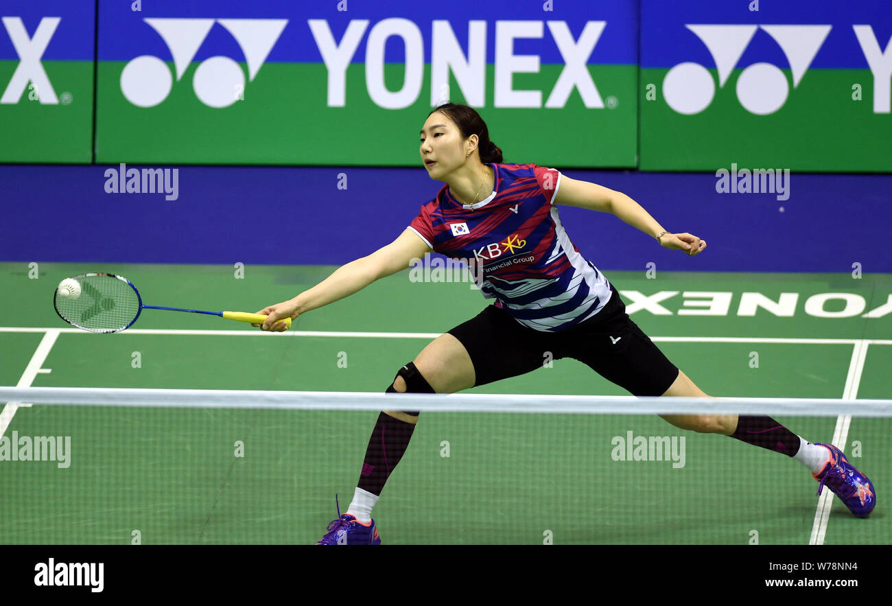 Sung Ji-hyun of South Korea returns a shot to Yip Pui Yin of Hong Kong ...