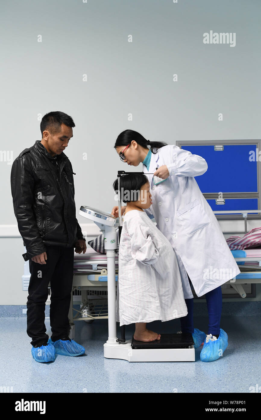 Chinese woman Wei Chunlan, center, who is just a little over three feet ...