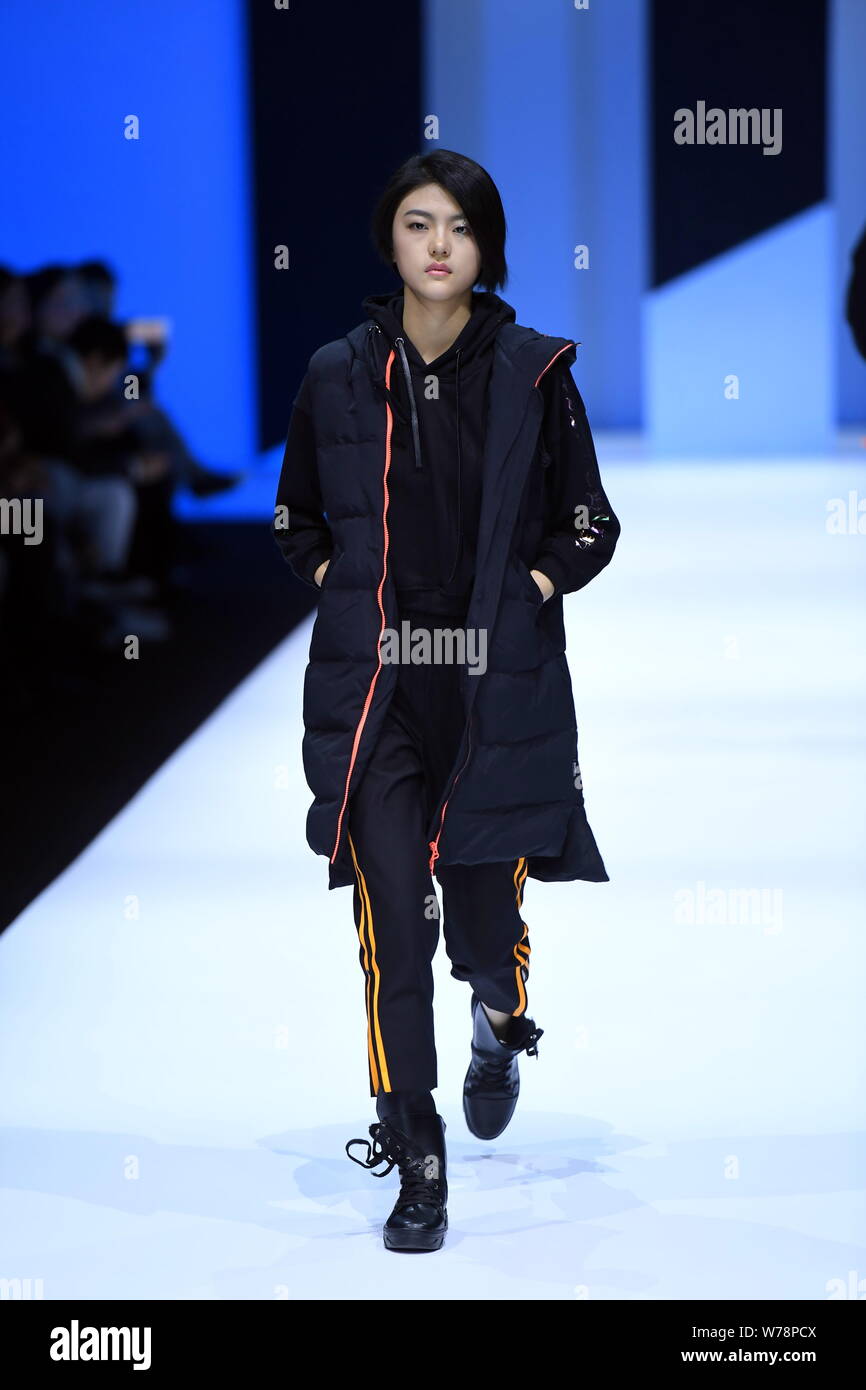 A model displays a new creation at the fashion show of BINGCHUAN by ...