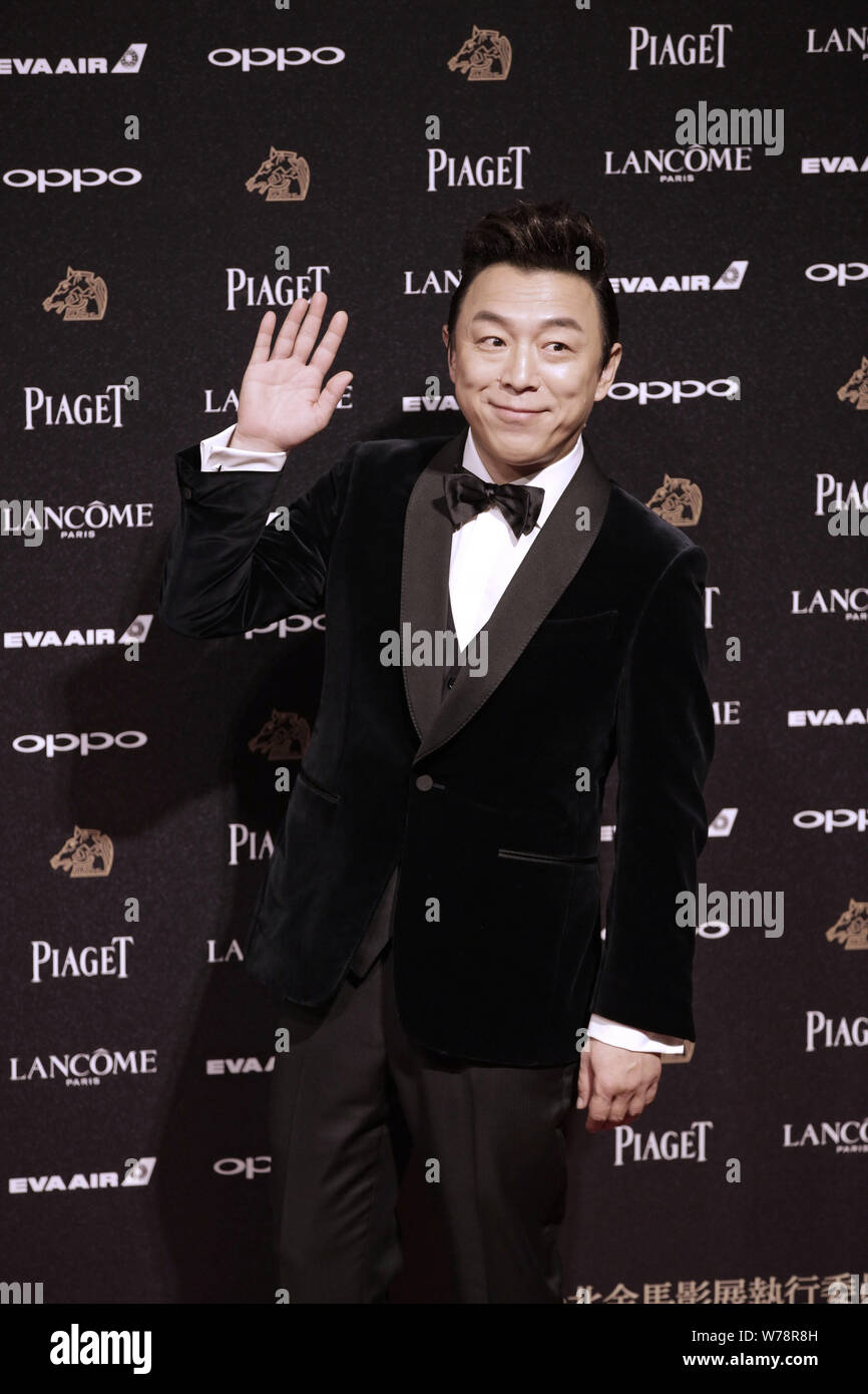 Chinese actor Huang Bo arrives on the red carpet for the 54th Golden ...