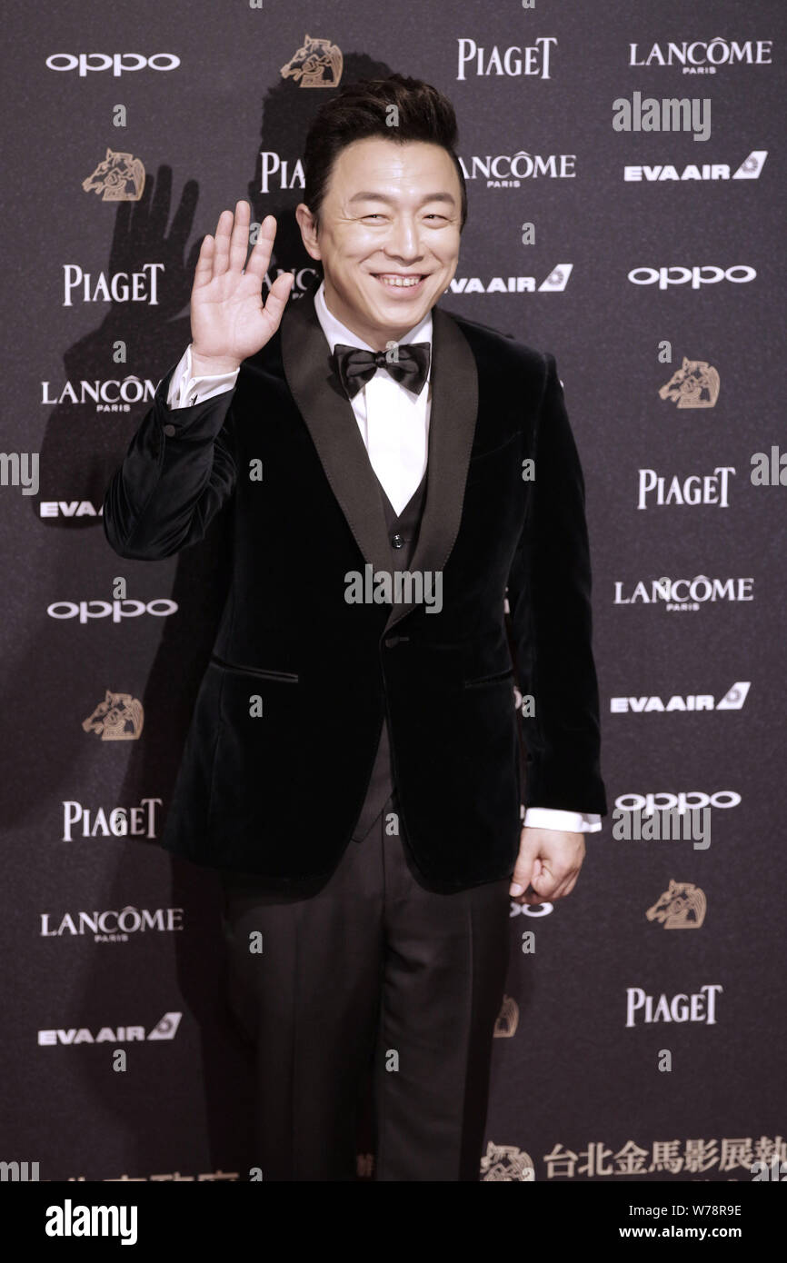 Chinese actor Huang Bo arrives on the red carpet for the 54th Golden ...