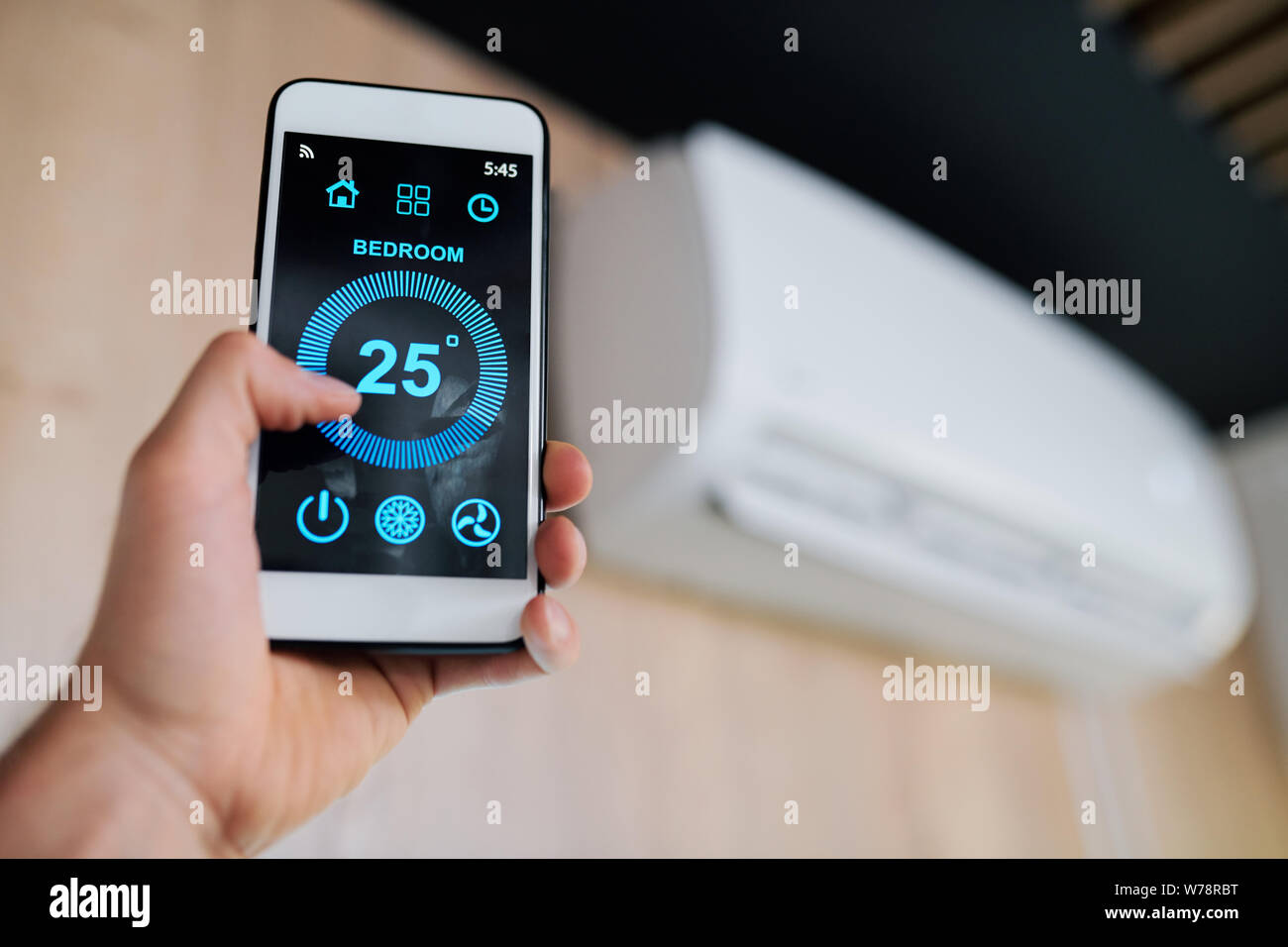 Optimal temperature of air in the room shown on display of smartphone ...