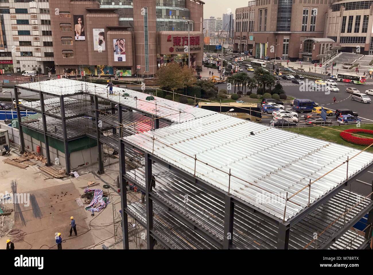 A ring-shaped pedestrian skywalk to connect malls is under construction ...