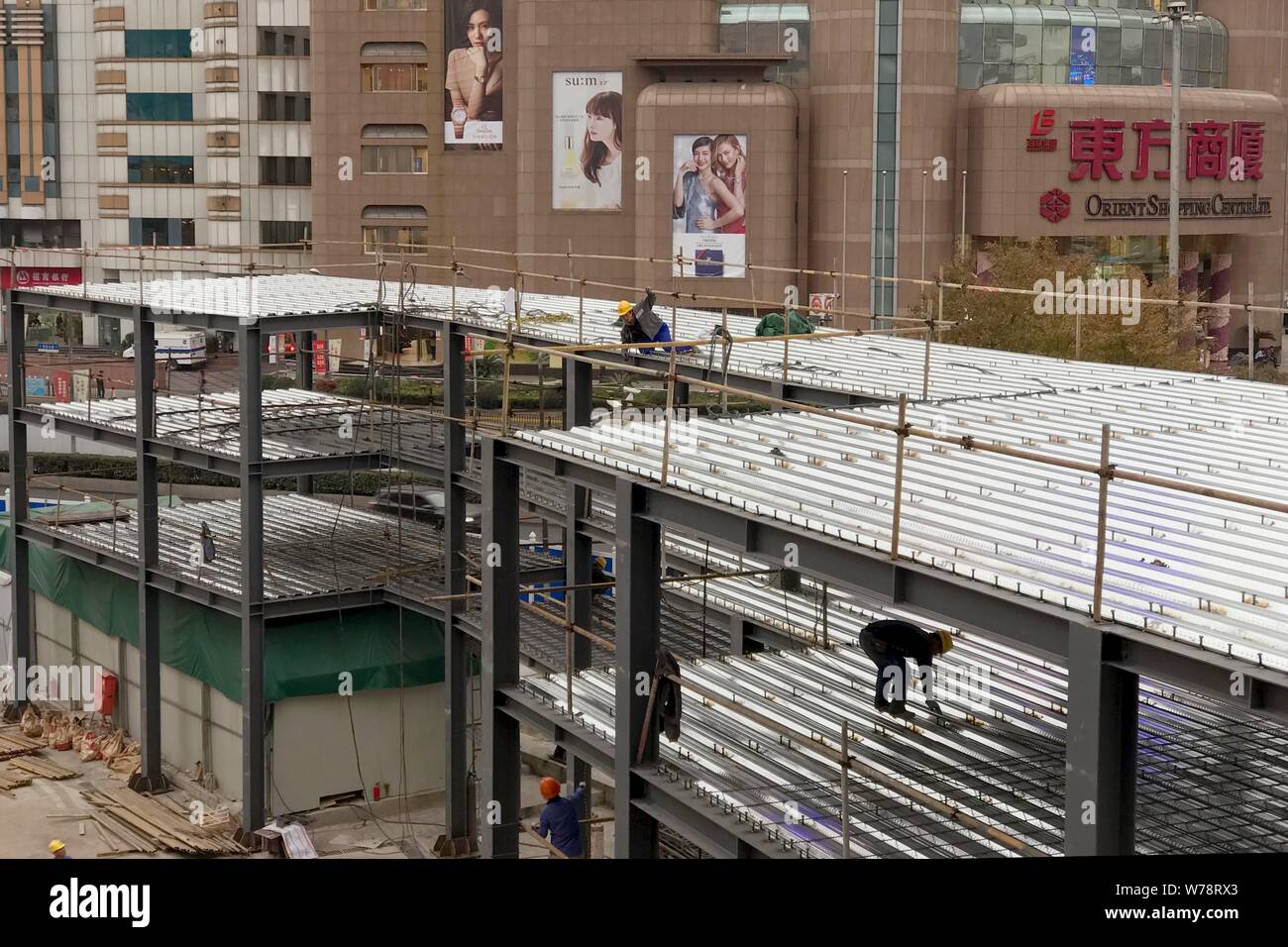 A ring-shaped pedestrian skywalk to connect malls is under construction ...