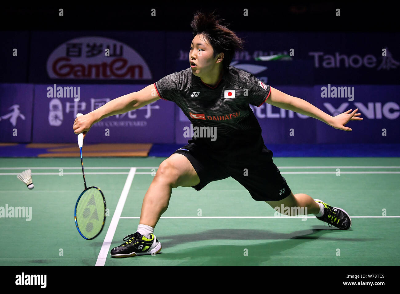 Akane Yamaguchi of Japan returns a shot to Ratchanok Intanon of ...