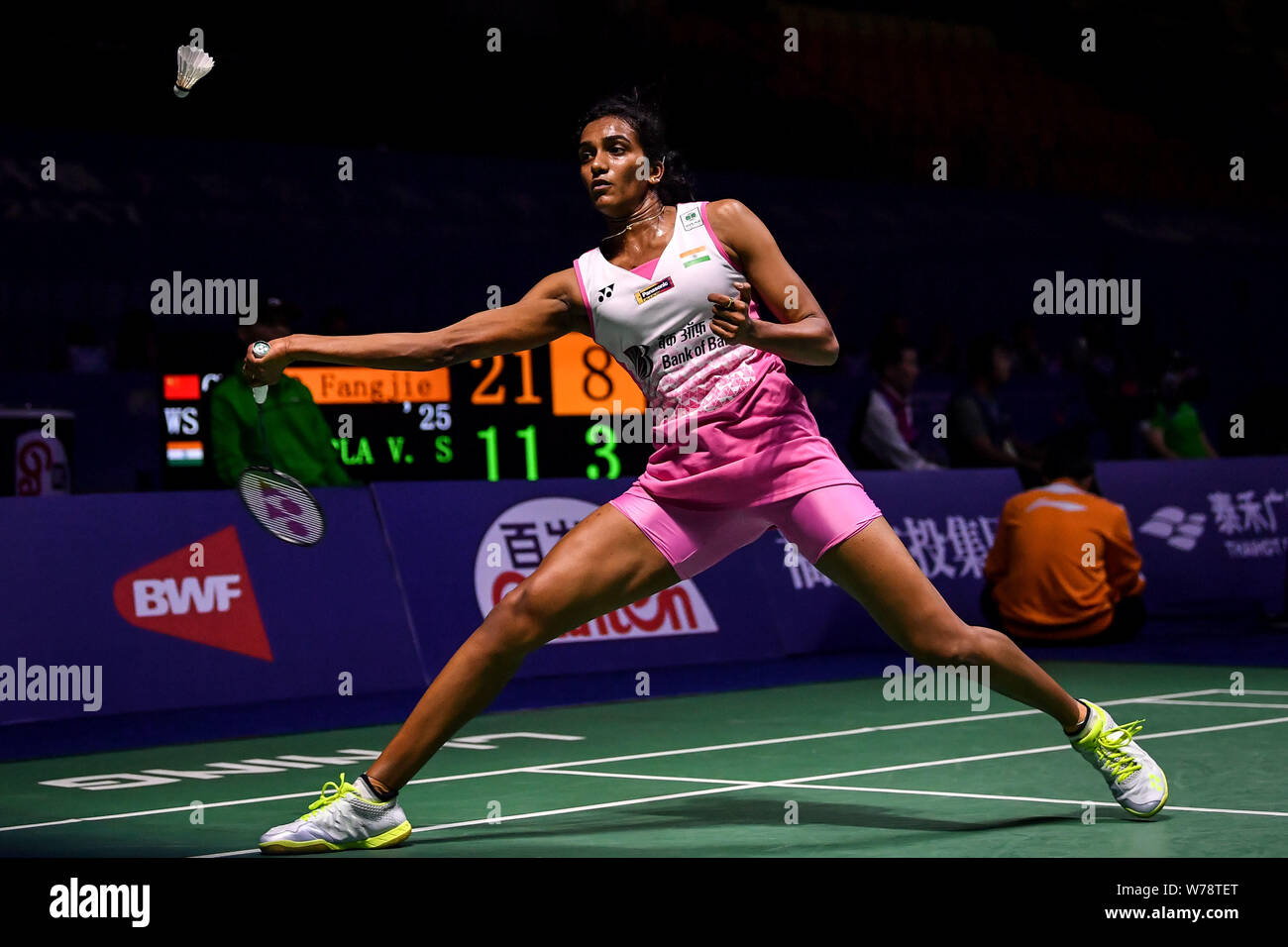 P. V. Sindhu of India returns a shot to Gao Fangjie of China in their ...