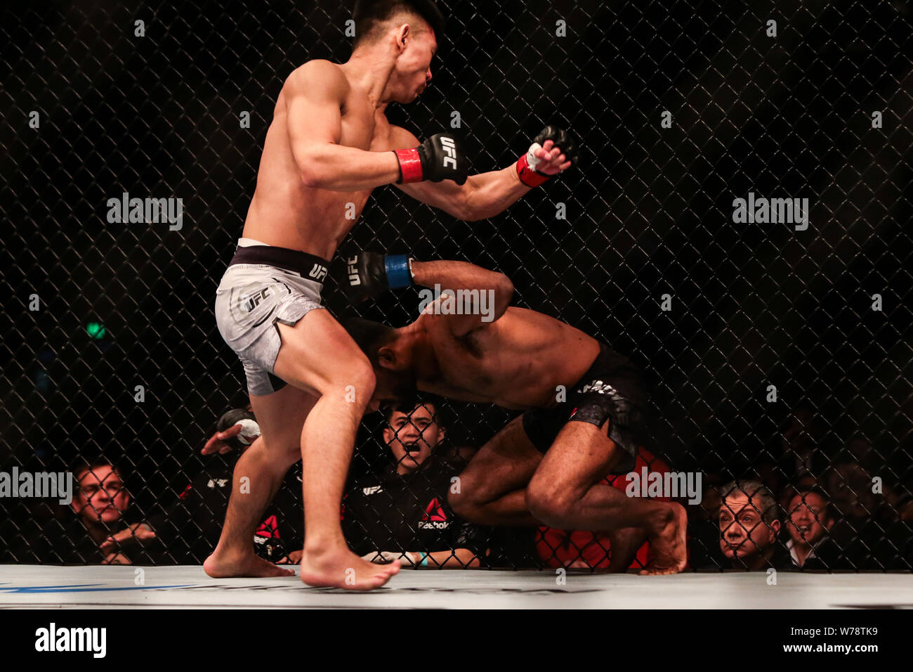 Chinese mixed martial artist Song Yadong, top, hits Indian mixed ...