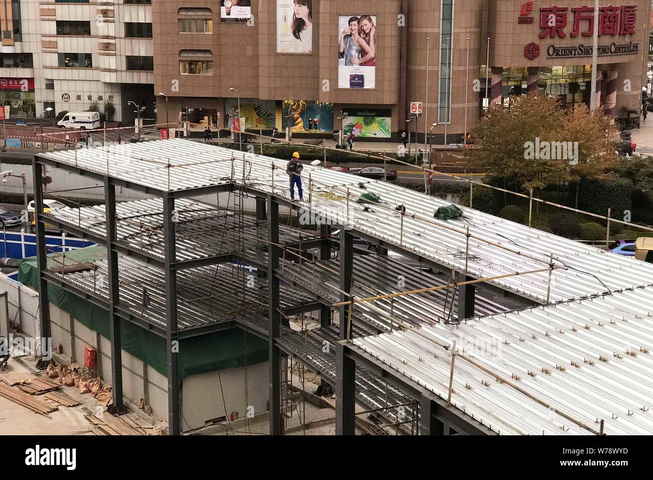 A ring-shaped pedestrian skywalk to connect malls is under construction ...