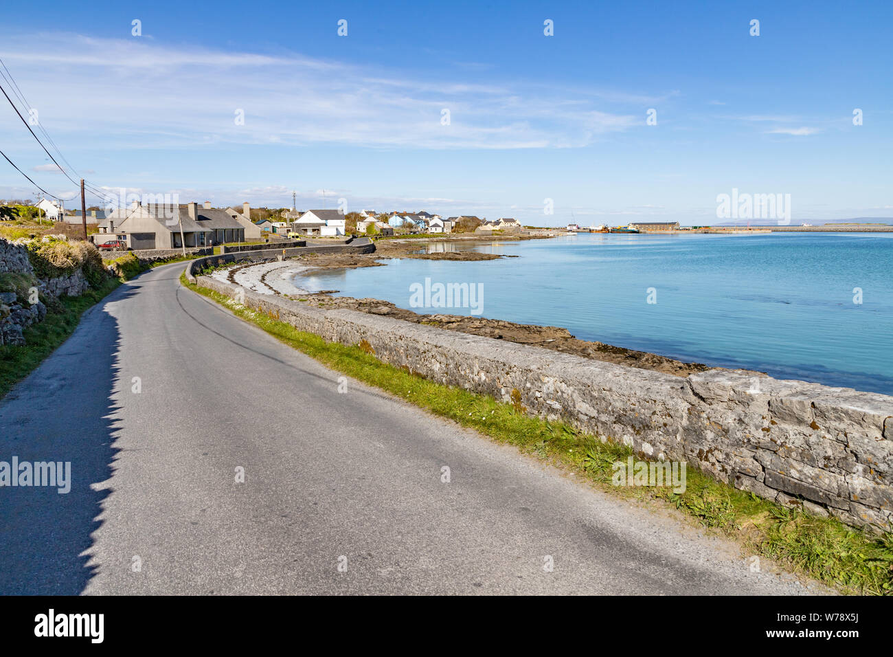 Buildings, road and beach in Kilronan village in Inishmore, Aran ...