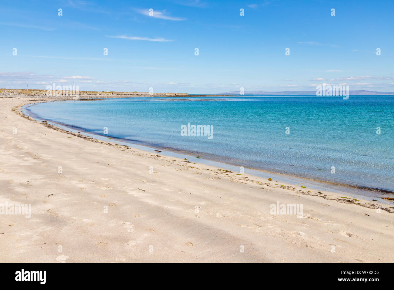 Beach with sand, rocks and seaweeds in Inishmore, Aran Islands, Ireland ...