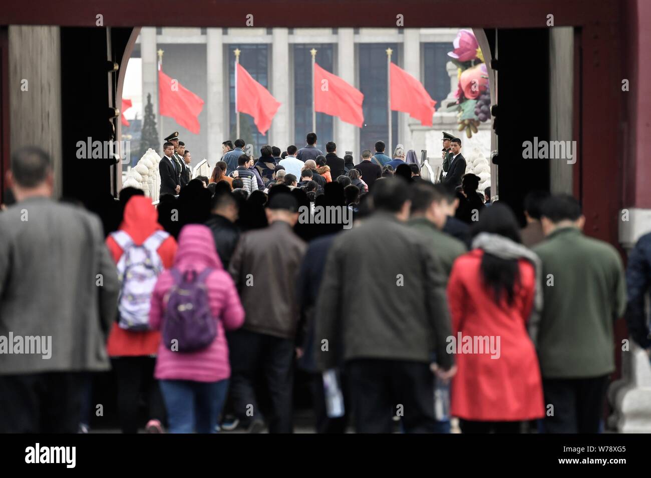 Tourists exit from the Palace Museum, also known as the Forbidden City ...