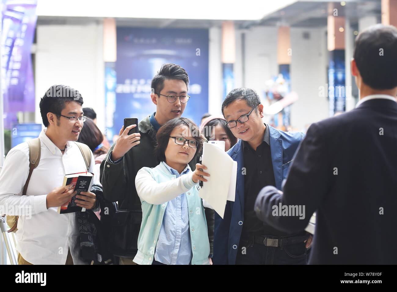 Chinese writer Liu Cixin, right, attends the 4th International Science ...