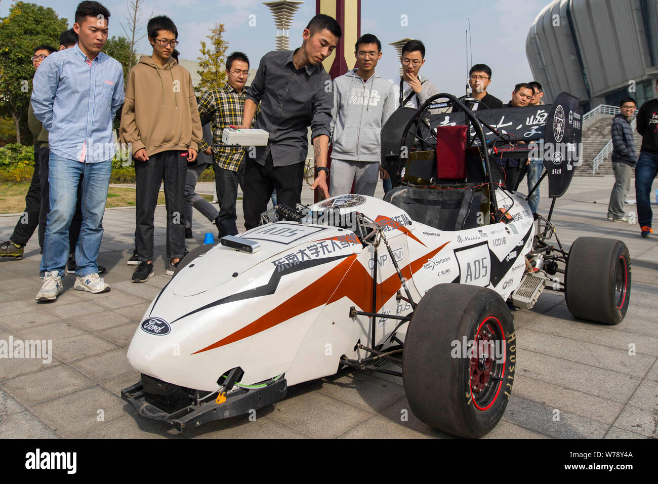 Students of Southeast University (SEU) Racing Team display the first ...