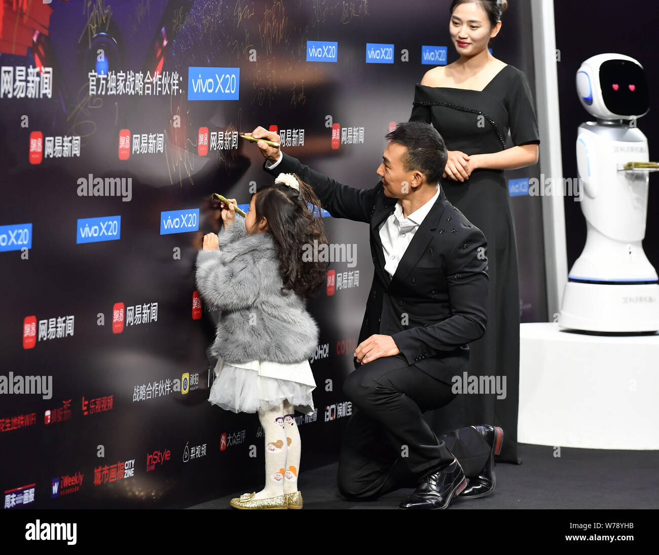 Taiwanese singer and actor Will Liu and his daughter Eve are pictured ...