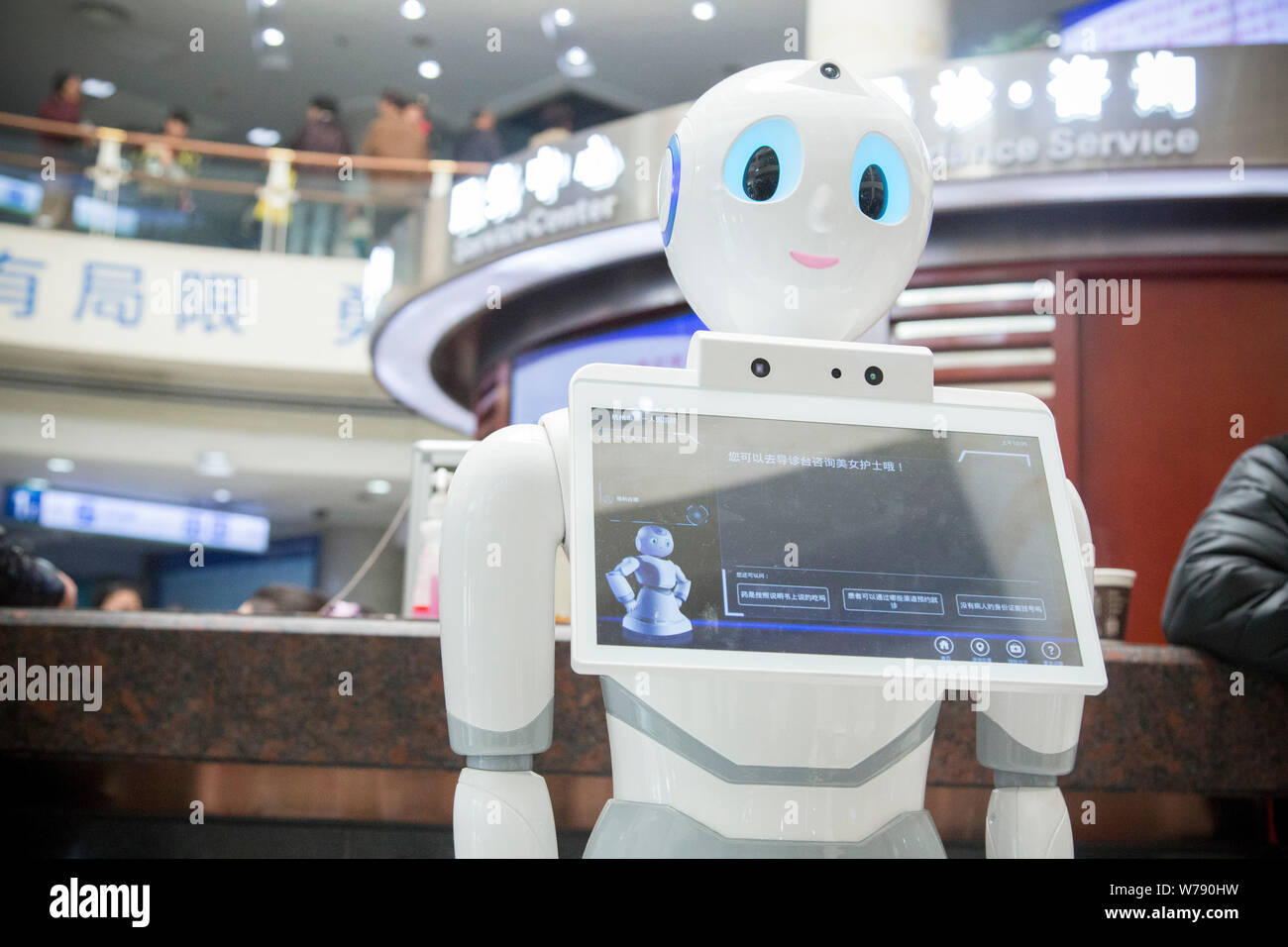 The smart robot, named Xiaoman, works as a receptionist at the ...