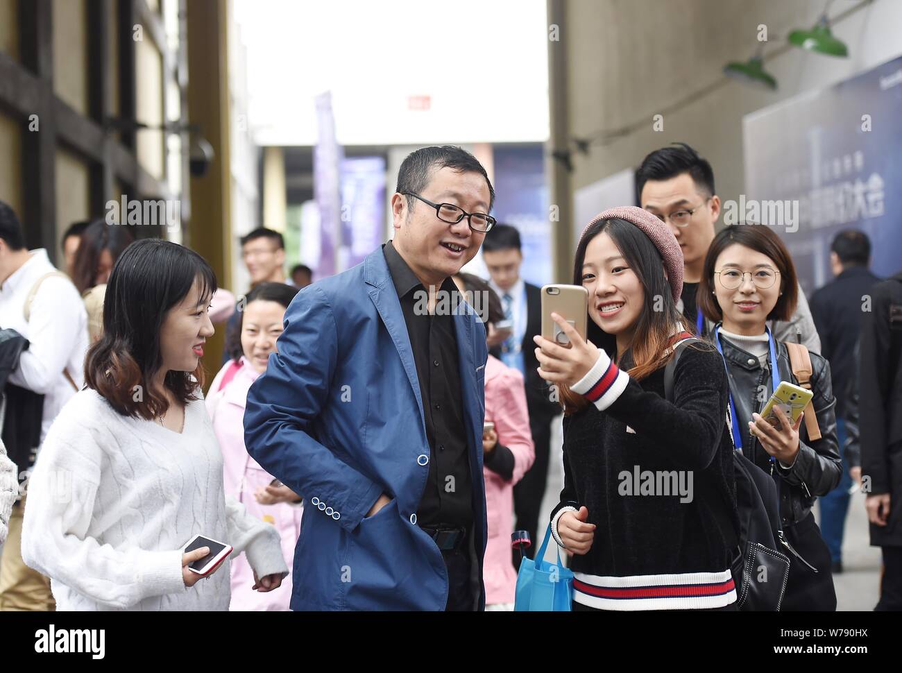 Chinese writer Liu Cixin, center, attends the 4th International Science ...