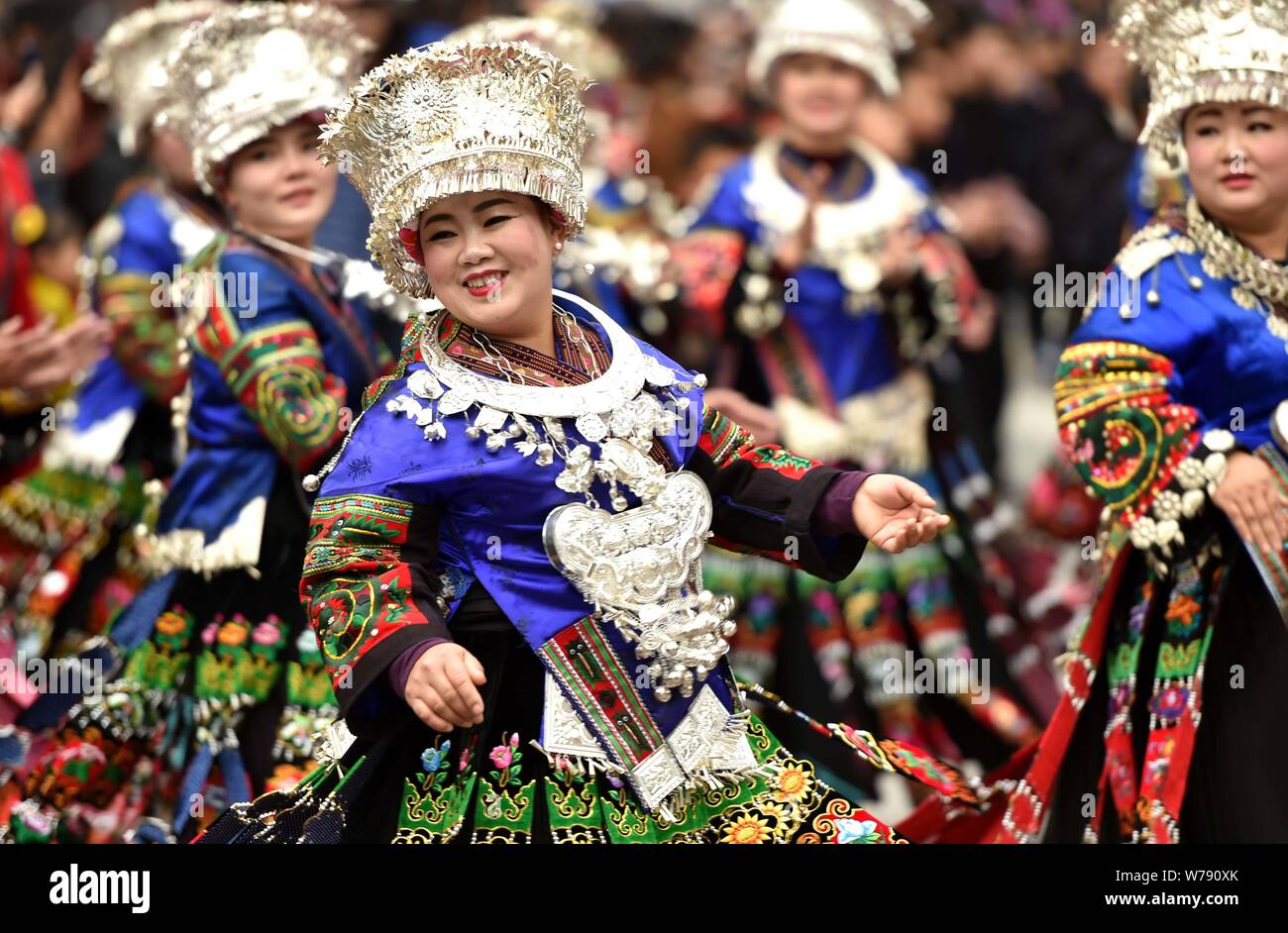 Chinese people of Miao ethnic minority dressed in traditional silver ...