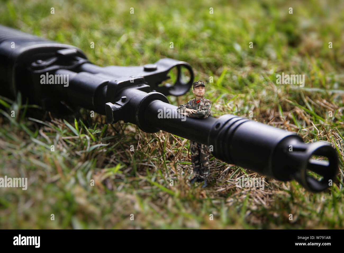 A Chinese soldier poses for a creative photo to mark the military life ...