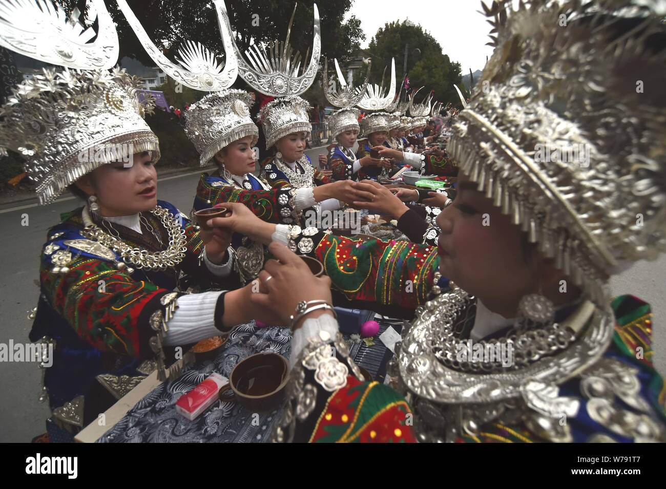Chinese people of Miao ethnic minority dressed in traditional silver ...