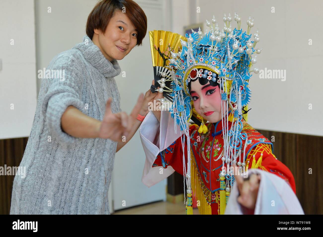 A primary student poses after finishing her hair and makeup dressed as ...