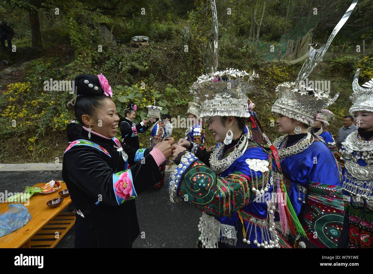 Chinese villagers of Miao ethnic group wearing traditional costumes ...