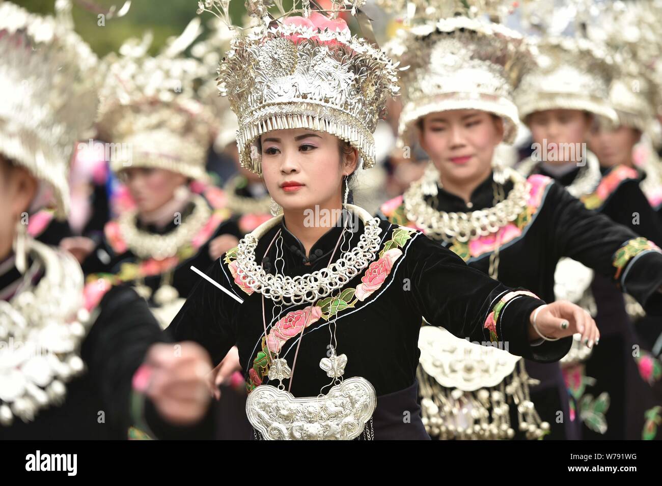 Chinese people of Miao ethnic minority dressed in traditional silver ...