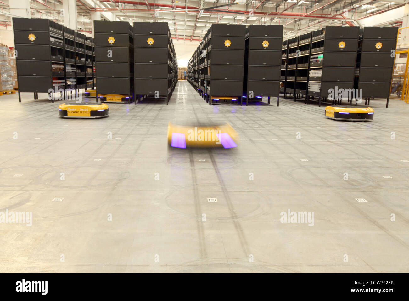 AGV (Automated Guided Vehicle) robots which are responsible for ...