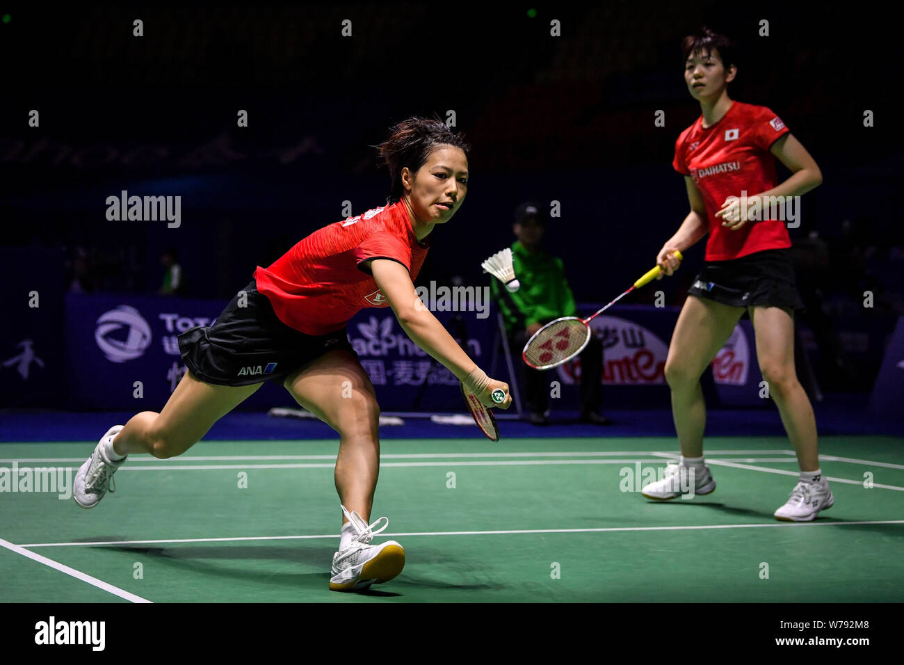 Fukushima Yuki and Sayaka Hirota of Japan compete against Chang Ching Hui and Yang Ching Tun of ...
