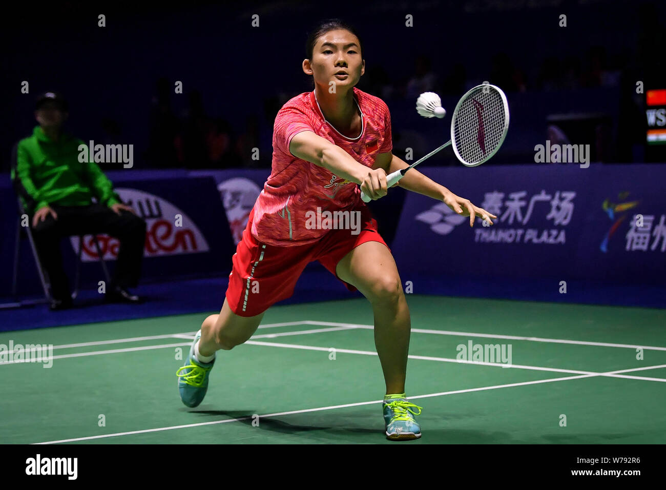 Han Yue of China returns a shot to P. V. Sindhu of India in their ...