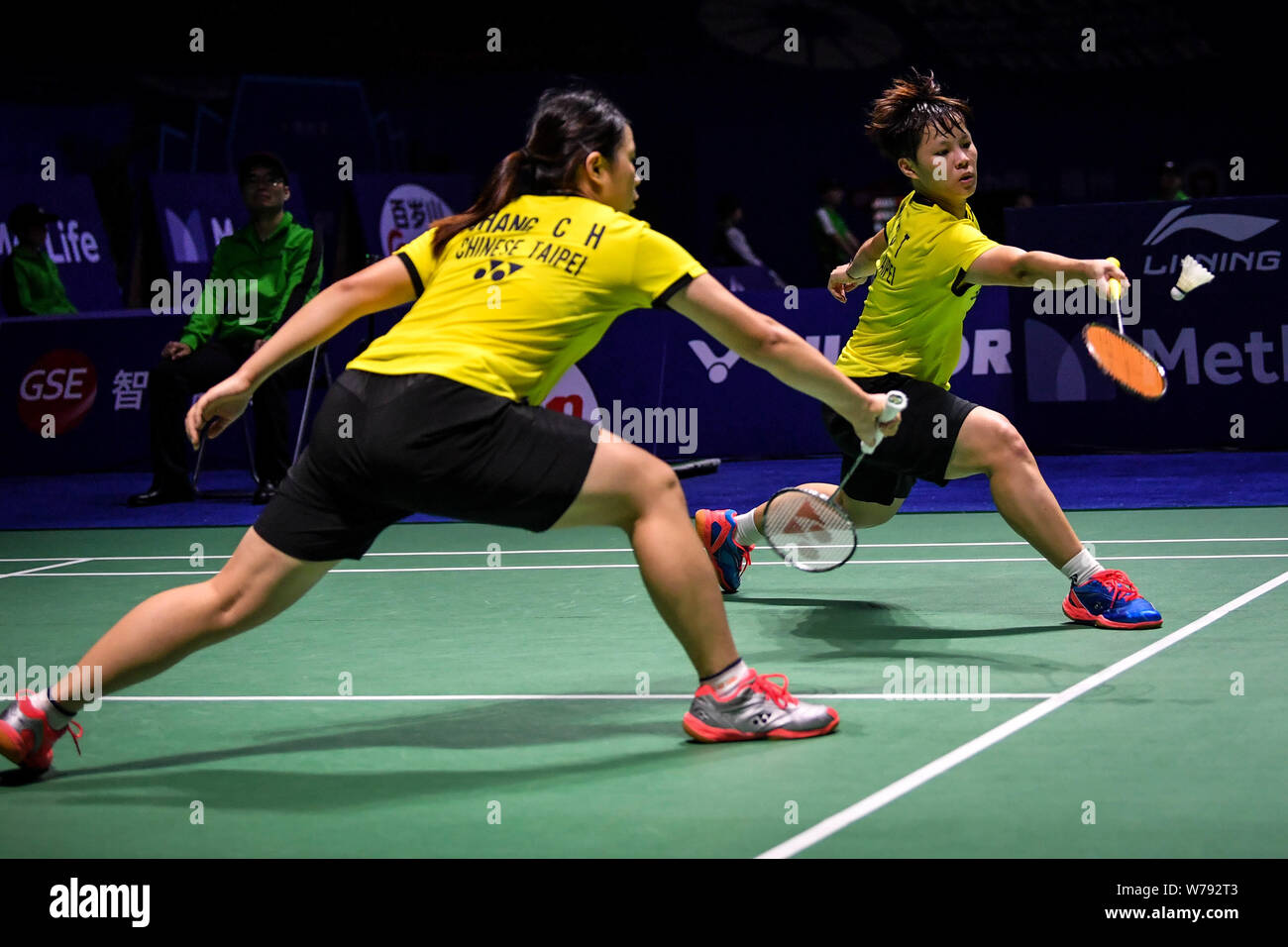 Chang Ching Hui and Yang Ching Tun of Chinese Taipei compete against Fukushima Yuki and Sayaka ...