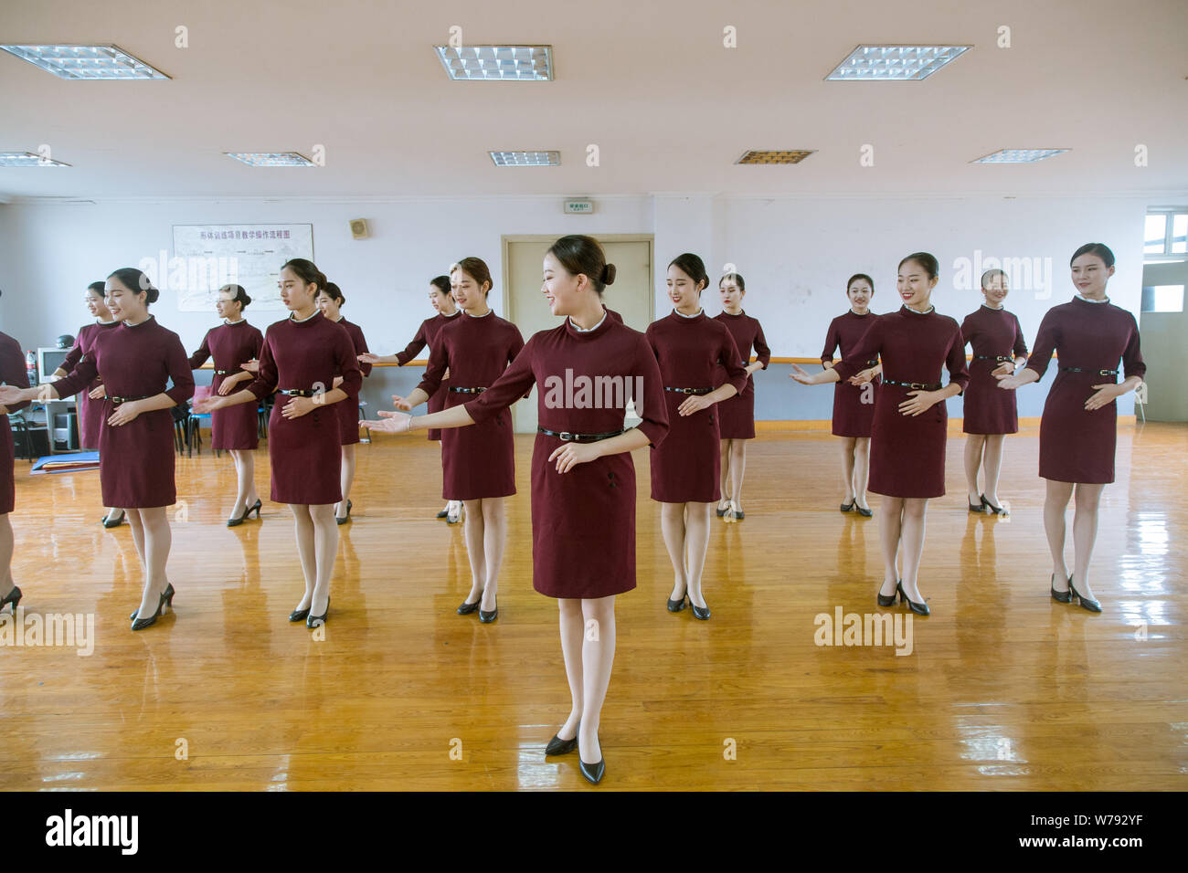 Volunteers practice welcoming posture to prepare during a training ...