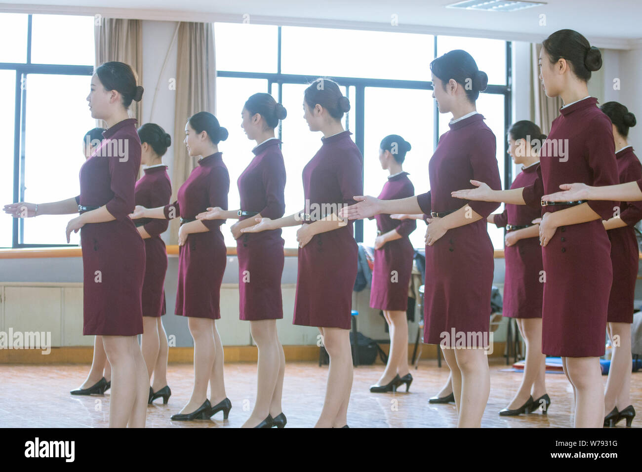 Volunteers practice welcoming posture to prepare during a training ...