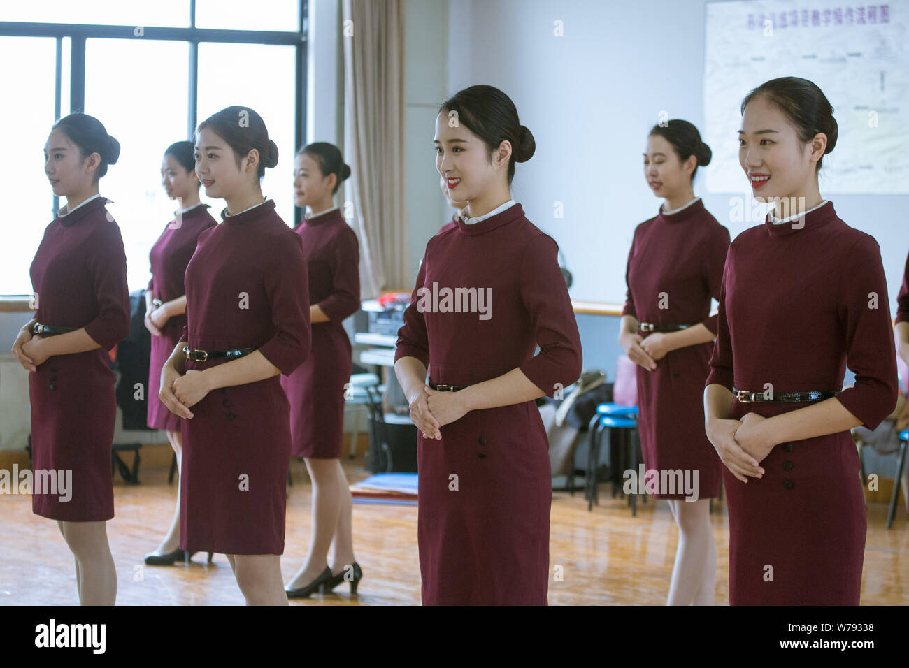 Volunteers practice welcoming posture to prepare during a training ...