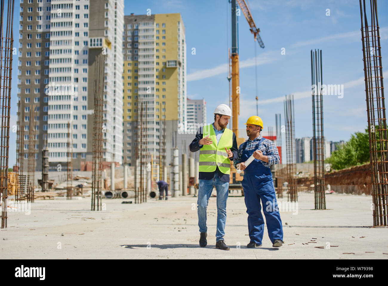 Two engineers discuss work related questions together Stock Photo - Alamy
