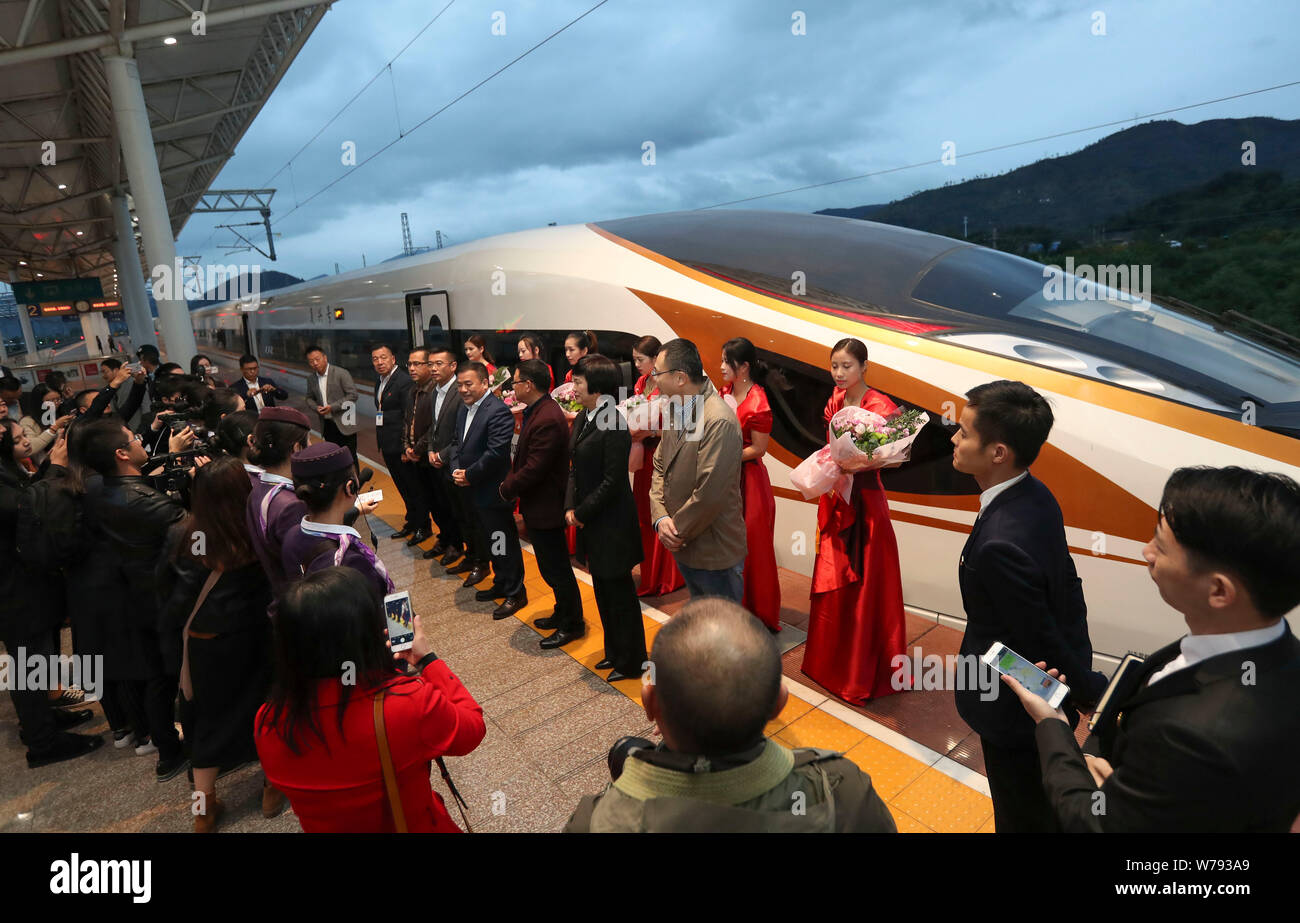 People celebrate a "Fuxing" high speed bullet train on Beijing-Shanghai ...