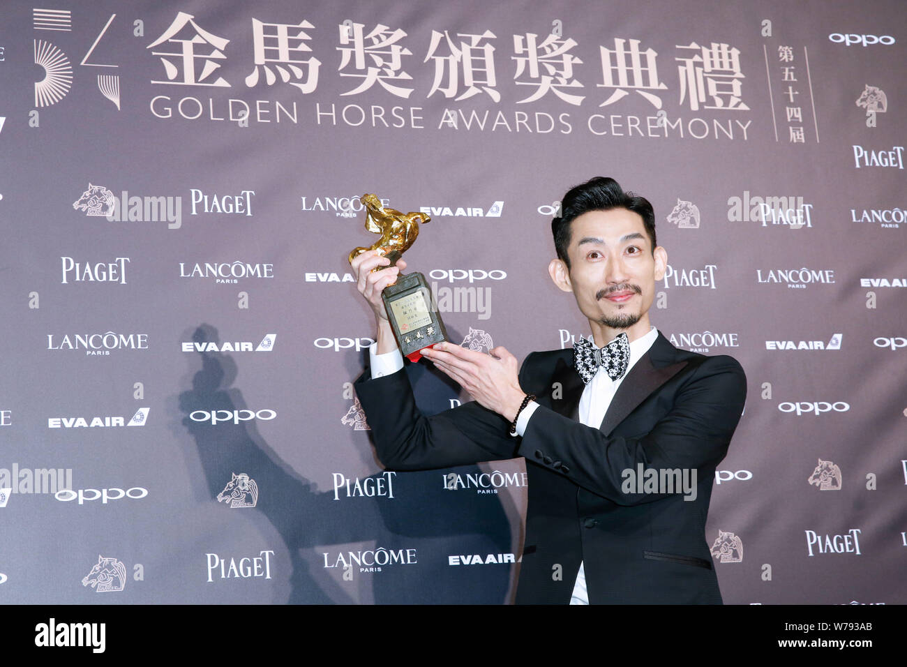 **TAIWAN OUT**Taiwanese actor Chen Chu-sheng poses with his trophy of ...