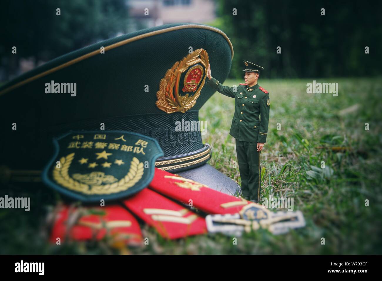 A Chinese soldier poses for a creative photo to mark the military life ...