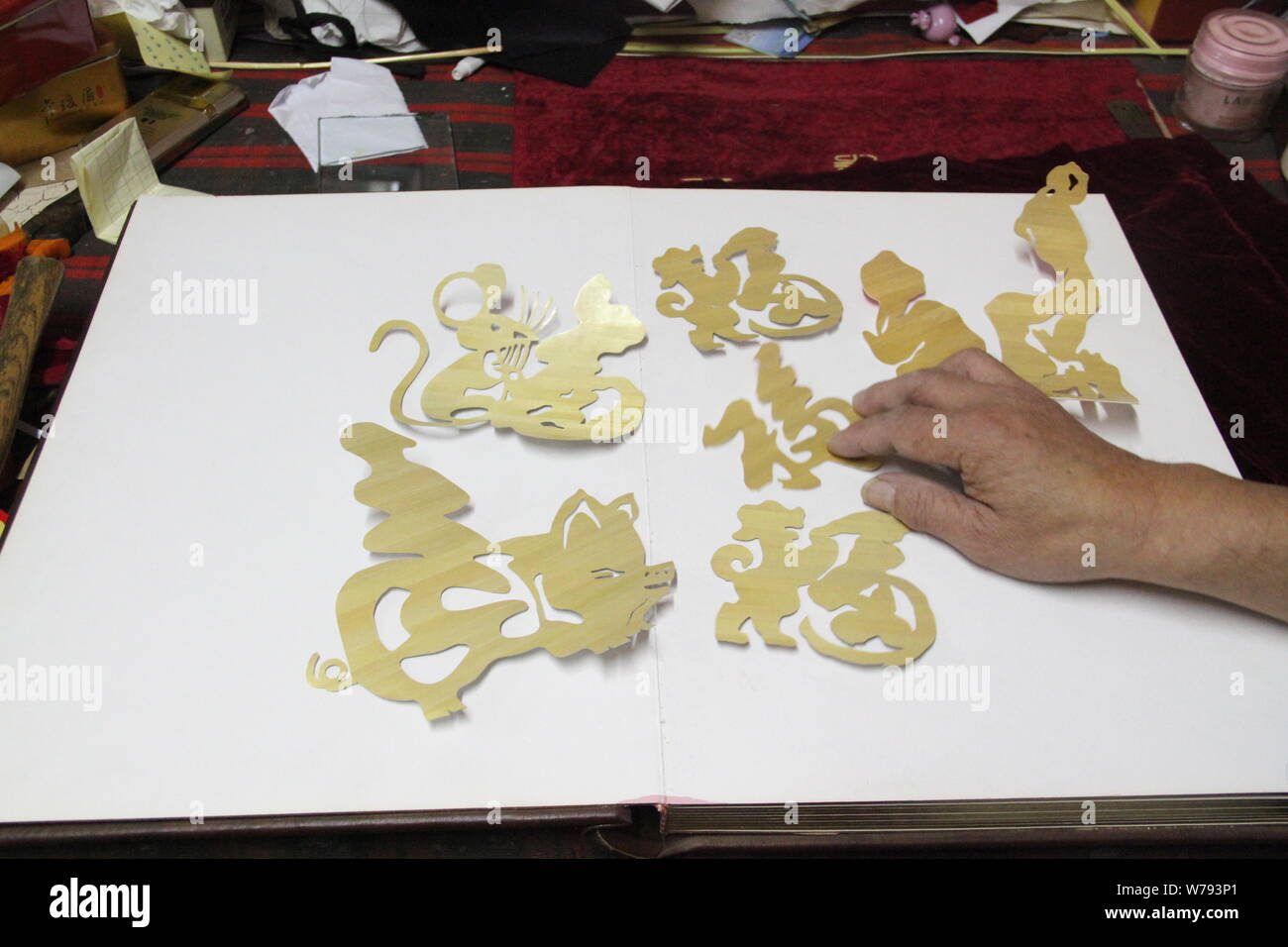 67-year-old Chinese man Zhang Chongsheng shows Chinese characters "Fu ...