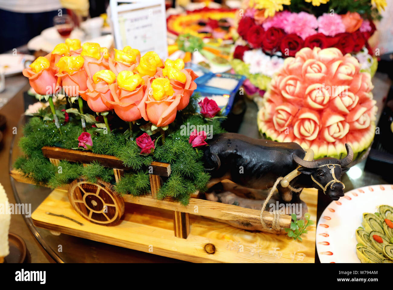 A flower dish "Orange shrimp on roses from Shangri-La" is on display at ...