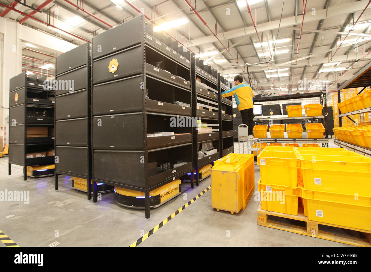A Chinese worker sort out parcels in the electronics logistics base of ...