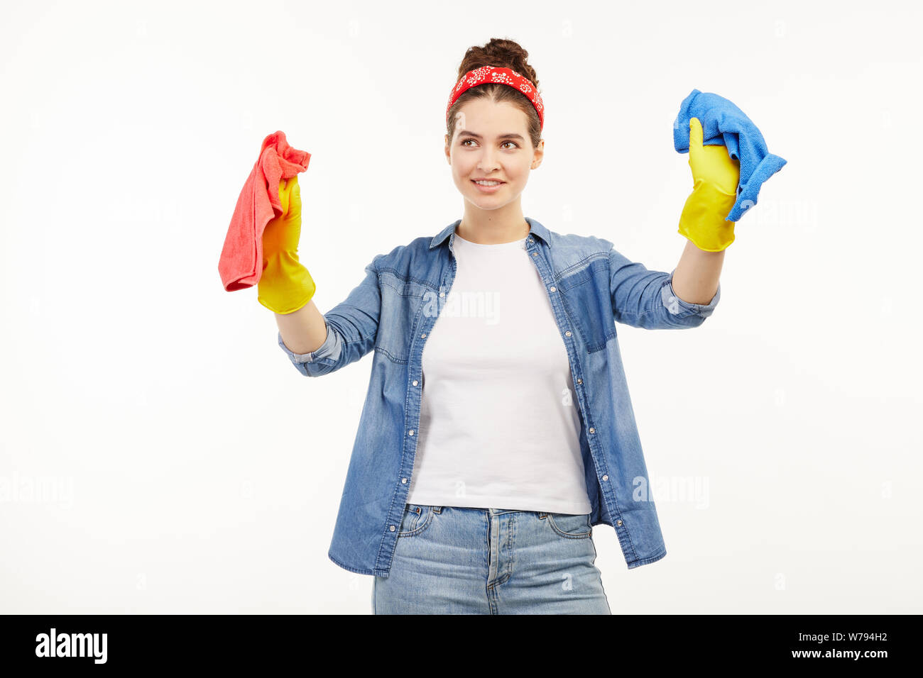 Pretty woman in work-wear uses different coloured rags Stock Photo - Alamy