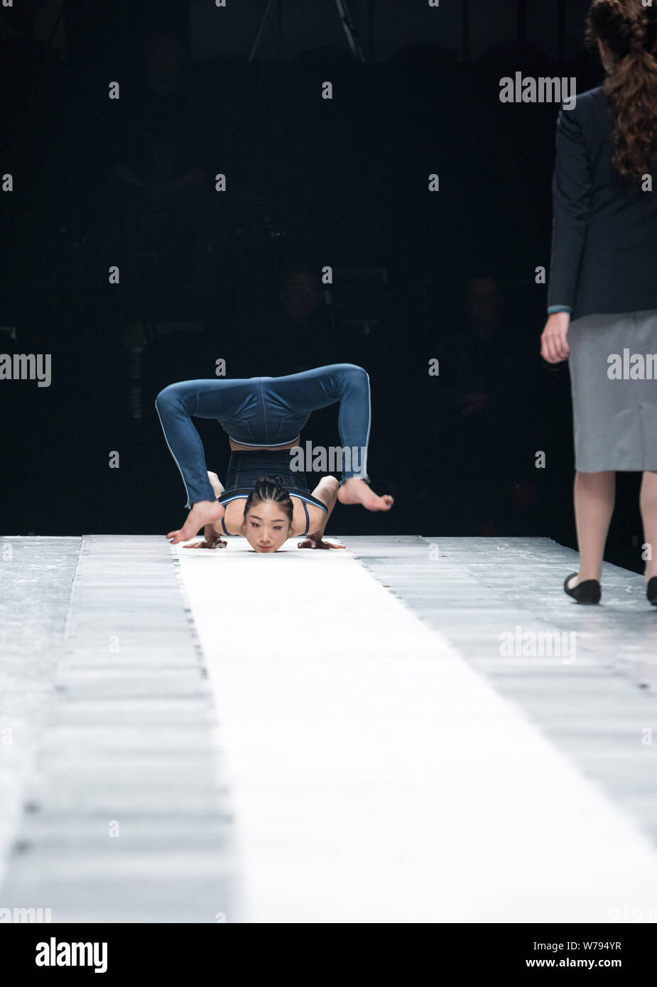 Chinese contortionist Liu Teng performs during an attempt to set a new ...