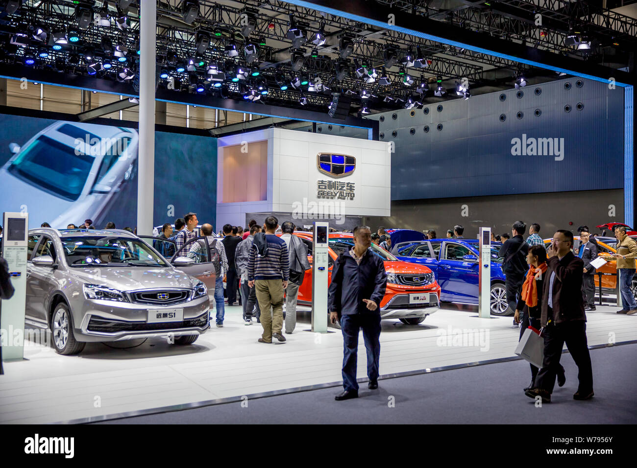--FILE--People visit the stand of Geely during the 15th China ...