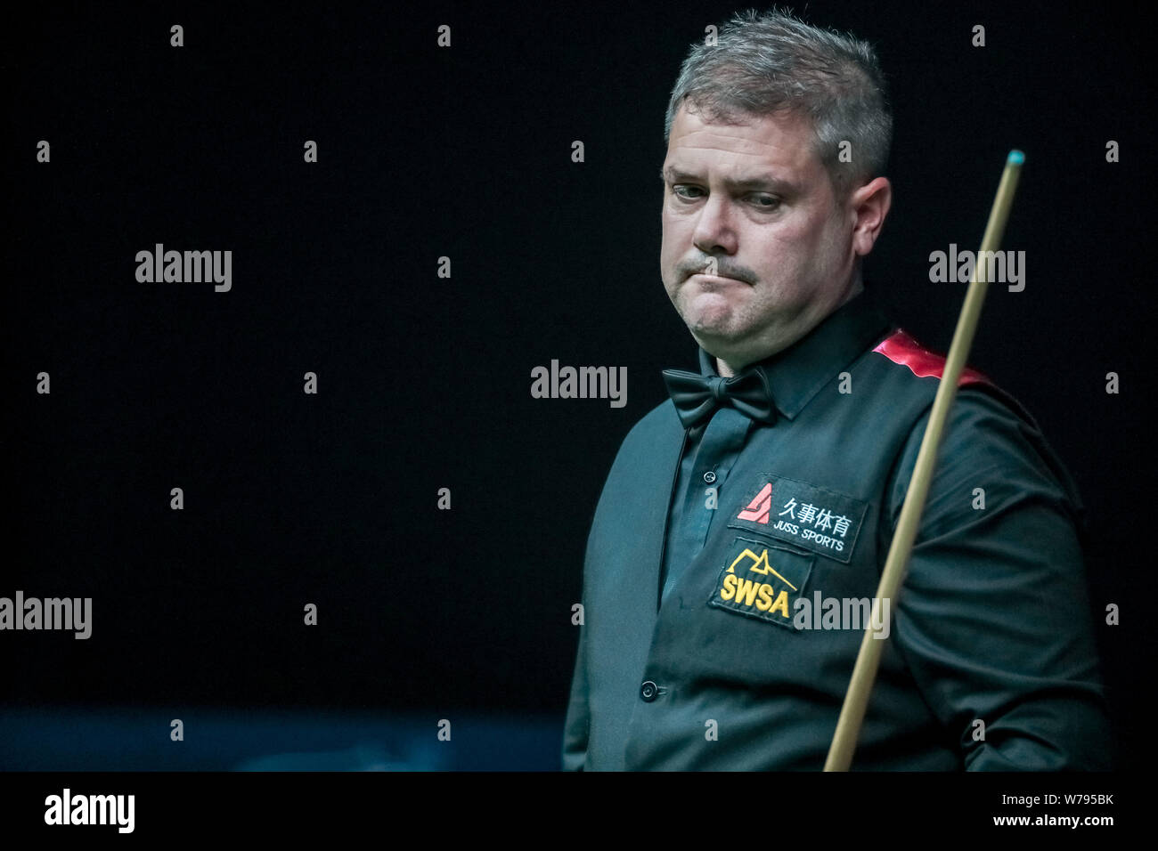 Robert Milkins of England considers a shot to Marco Fu of Hong Kong in ...