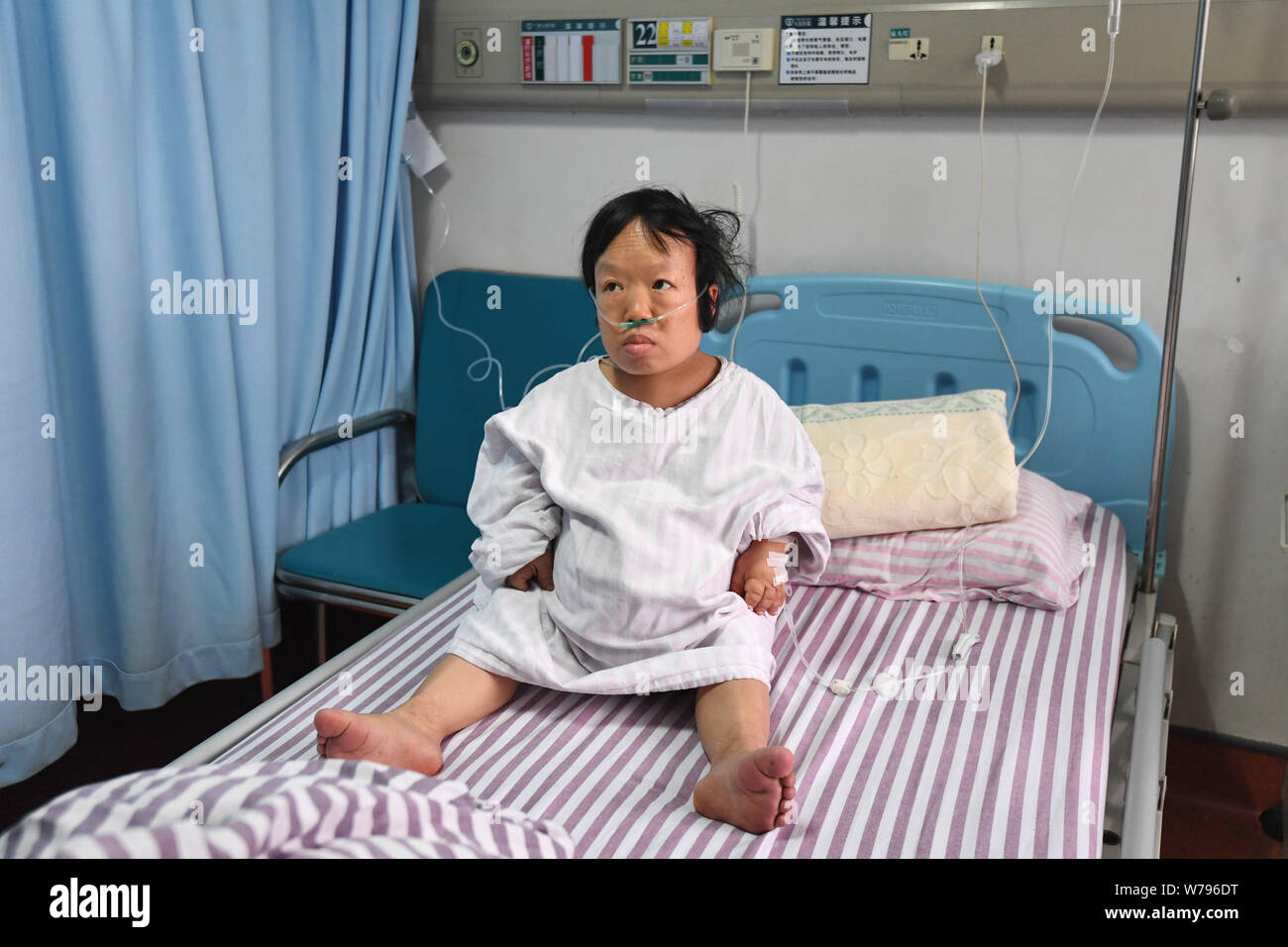 Chinese woman Wei Chunlan who is just a little over three feet tall ...