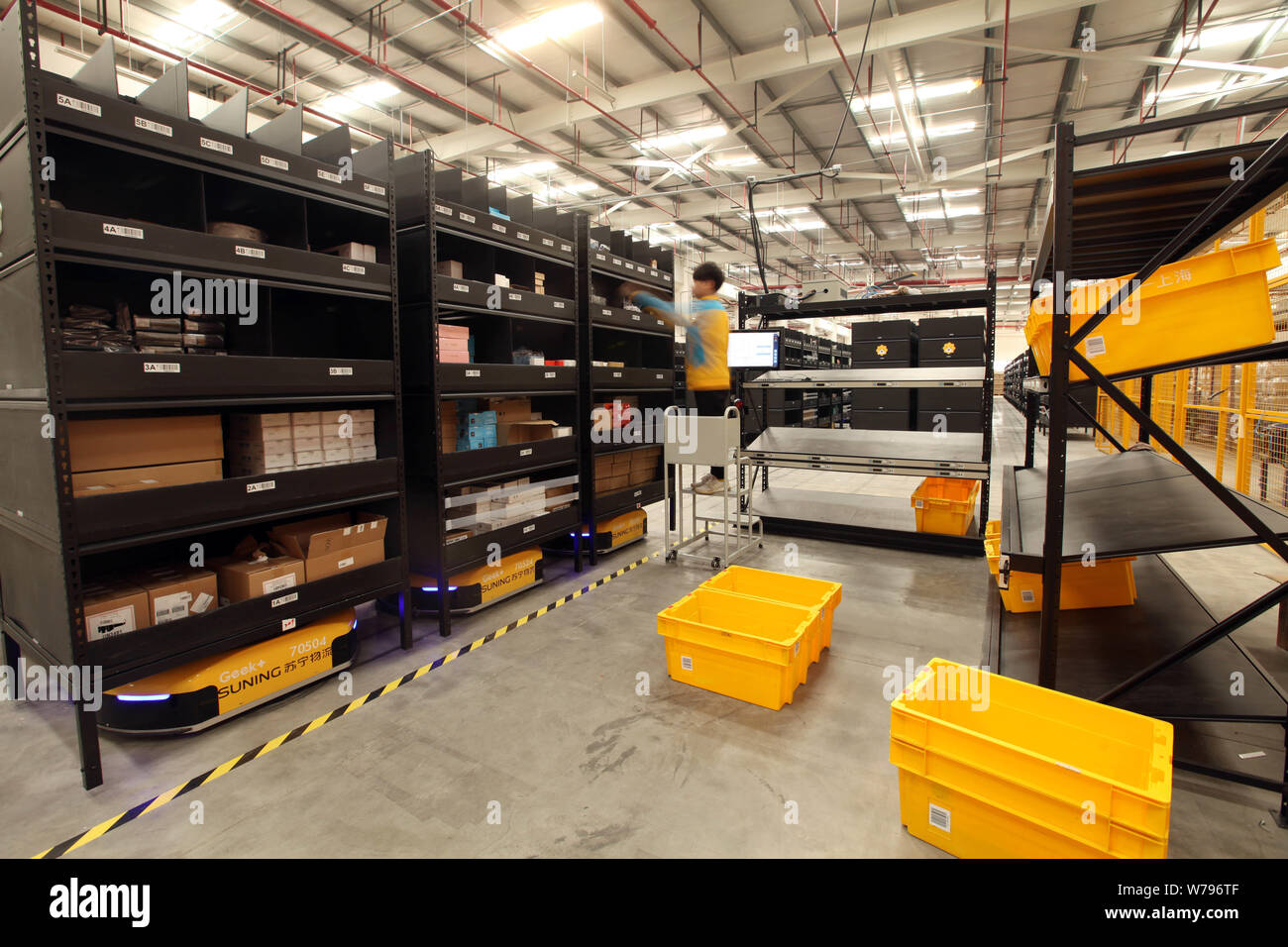 A Chinese worker sort out parcels in the electronics logistics base of ...