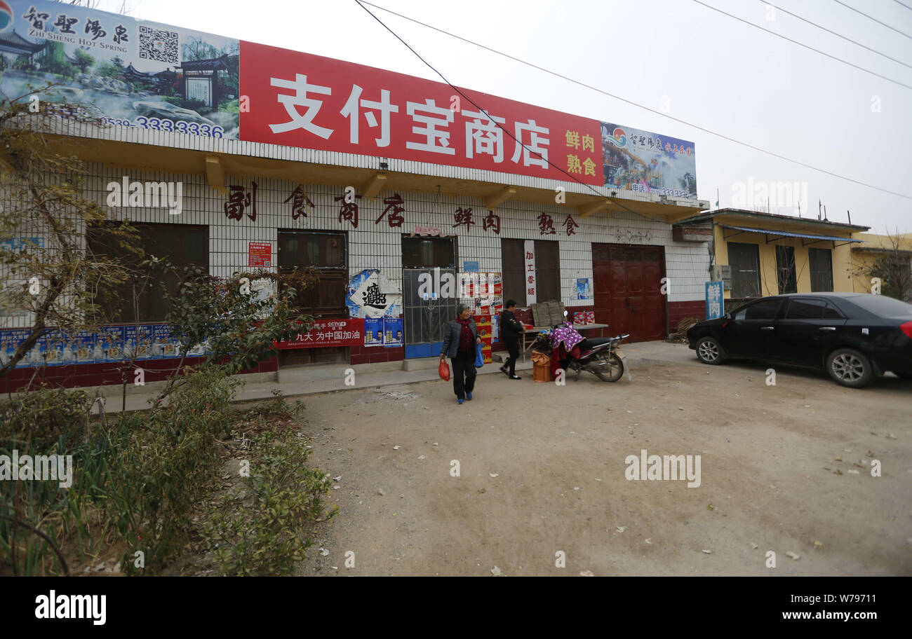 Customers leave the grocery store, Zhifubao Store, opened by 56-year ...