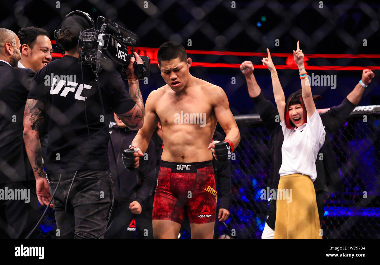 Chinese mixed martial artist Li Jingliang poses to celebrate after ...