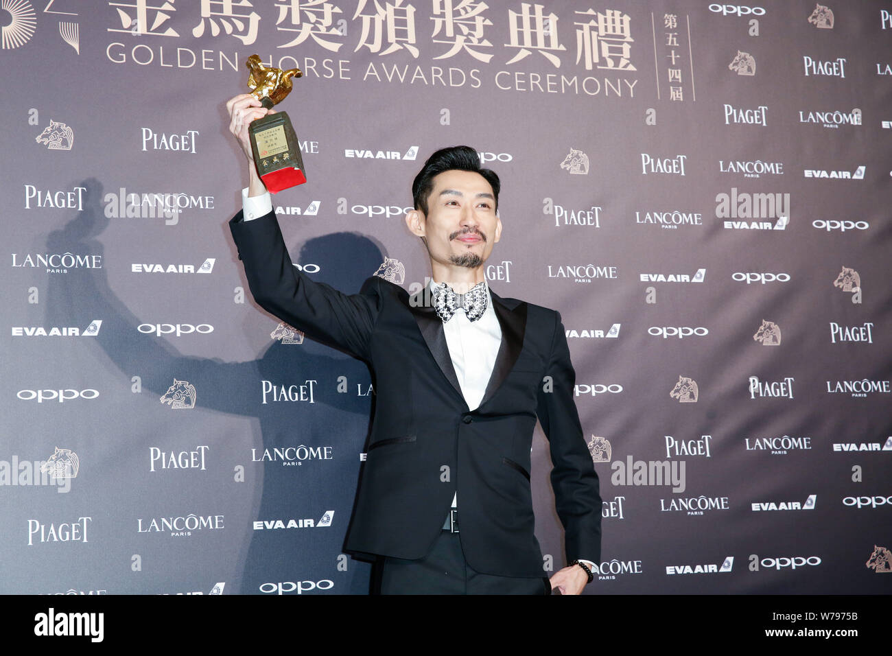 **TAIWAN OUT**Taiwanese actor Chen Chu-sheng poses with his trophy of ...